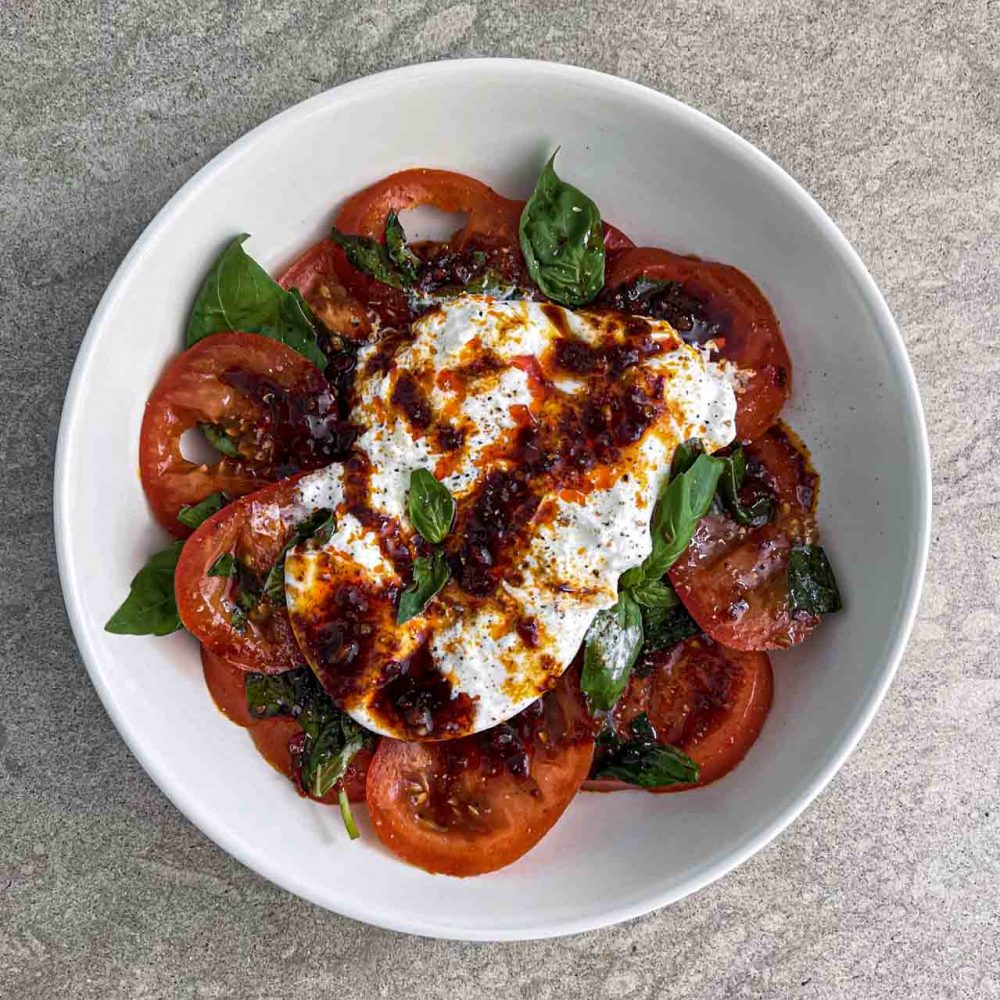 Burrata and Tomato Salad With Harissa Dressing